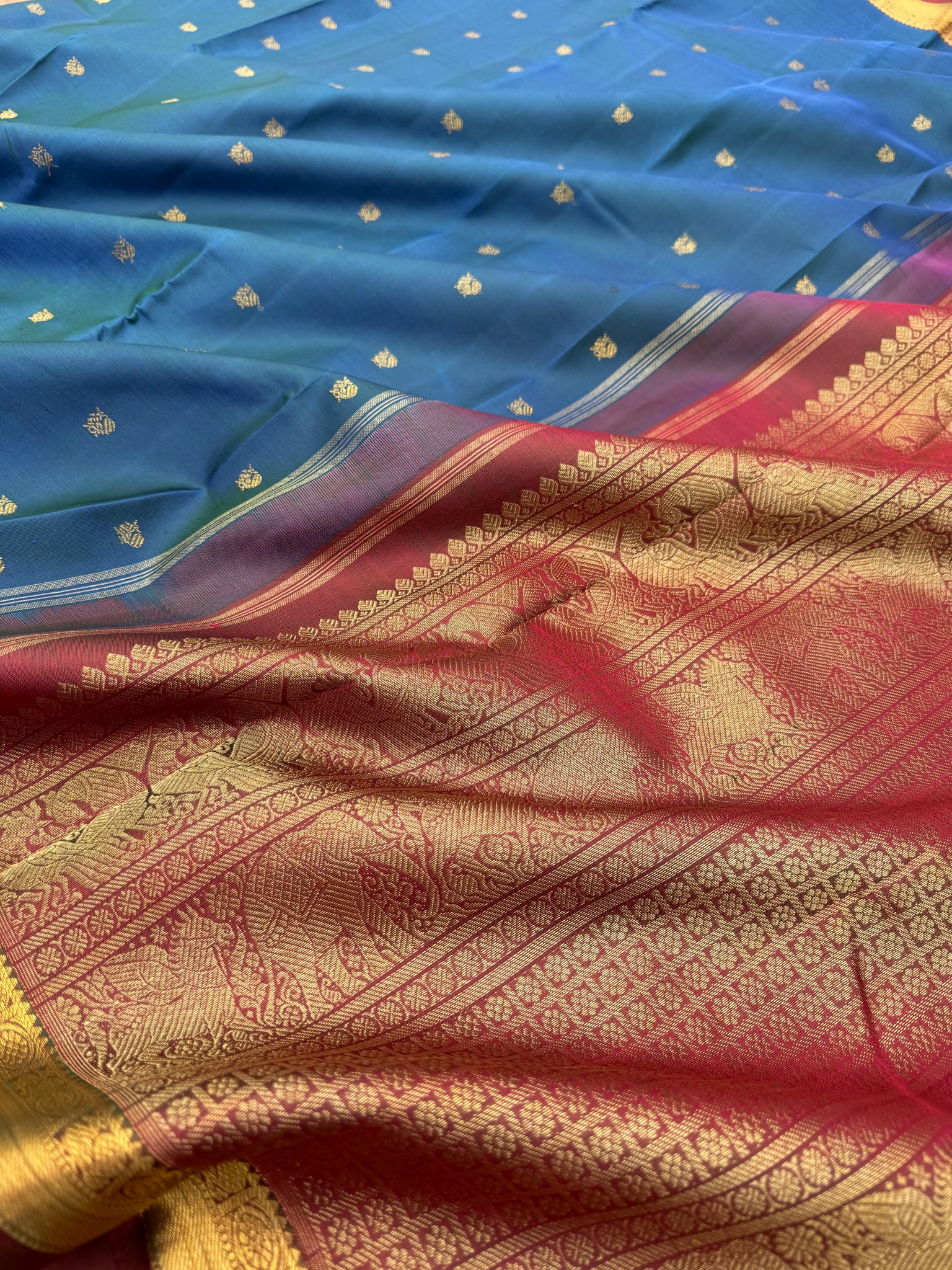 Swarnam - Small Border Kanchivaram -a deep dark peacock blue on rusty ...